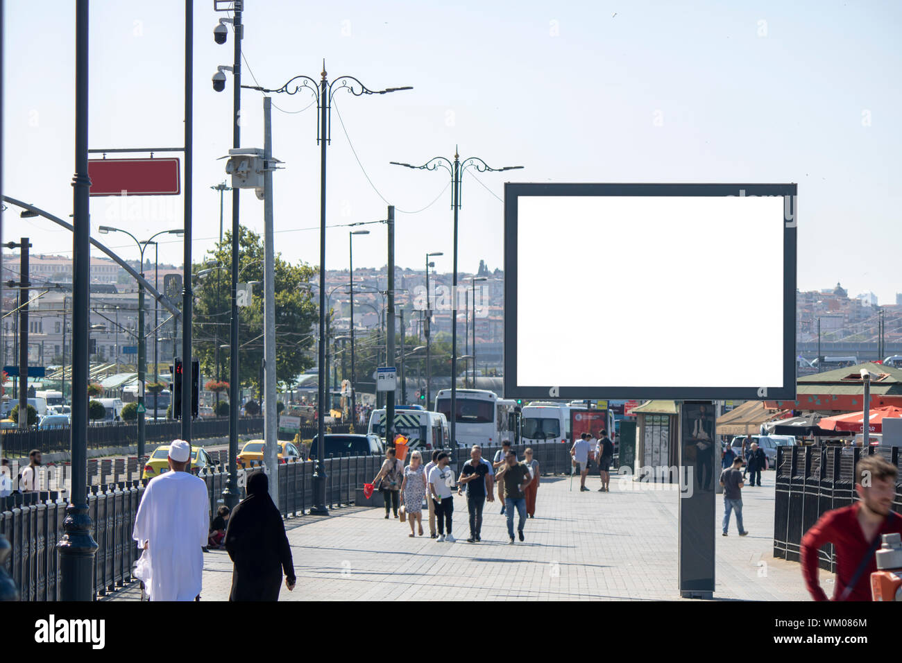 People walking on the street and advertising sign Stock Photo - Alamy