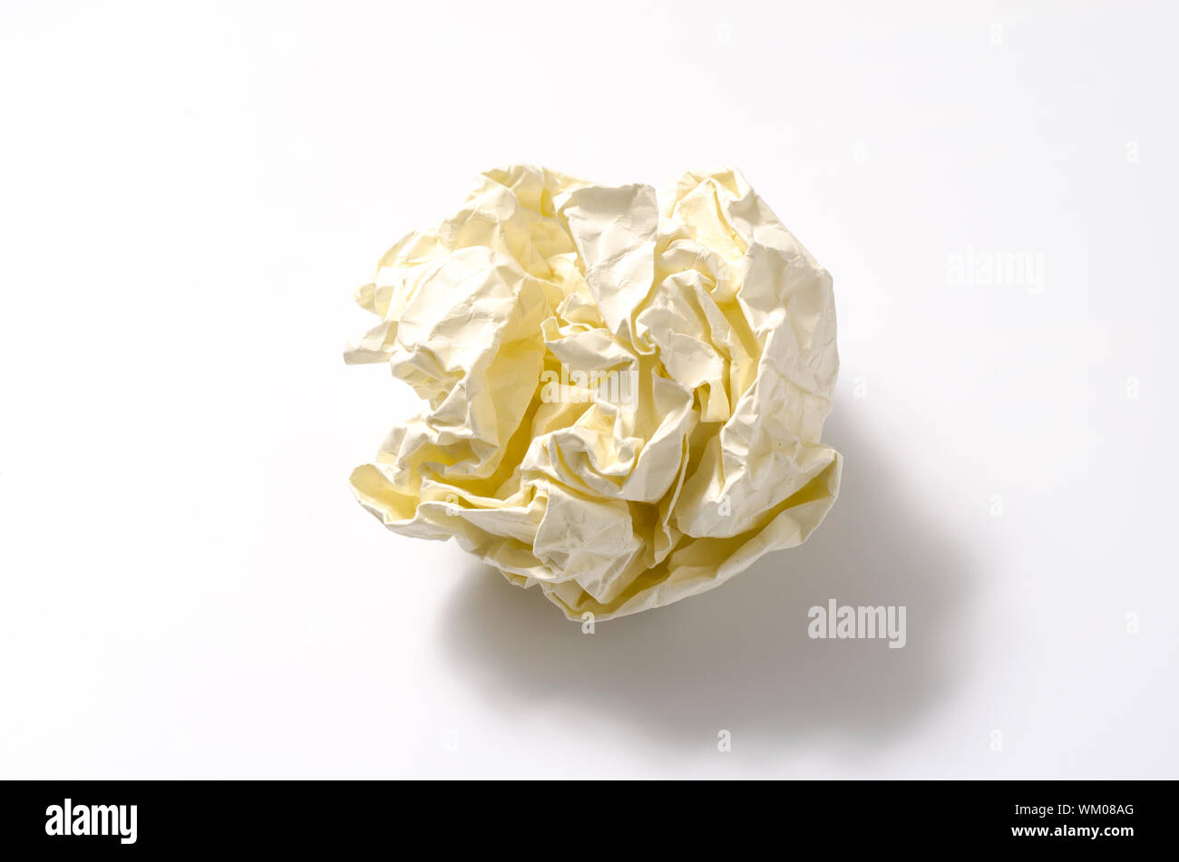 crumpled paper ball on a white background Stock Photo - Alamy