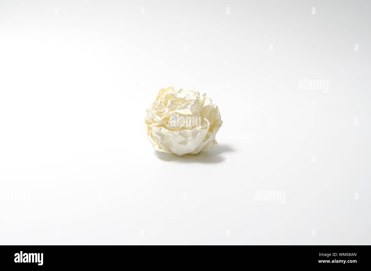 crumpled paper ball on a white background Stock Photo - Alamy