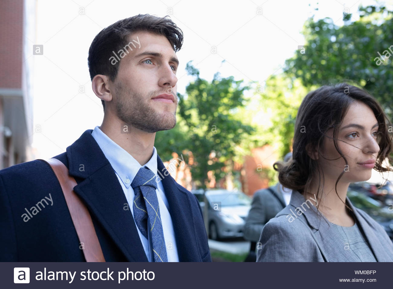 Professional couple commuting to work in suits Stock Photo - Alamy