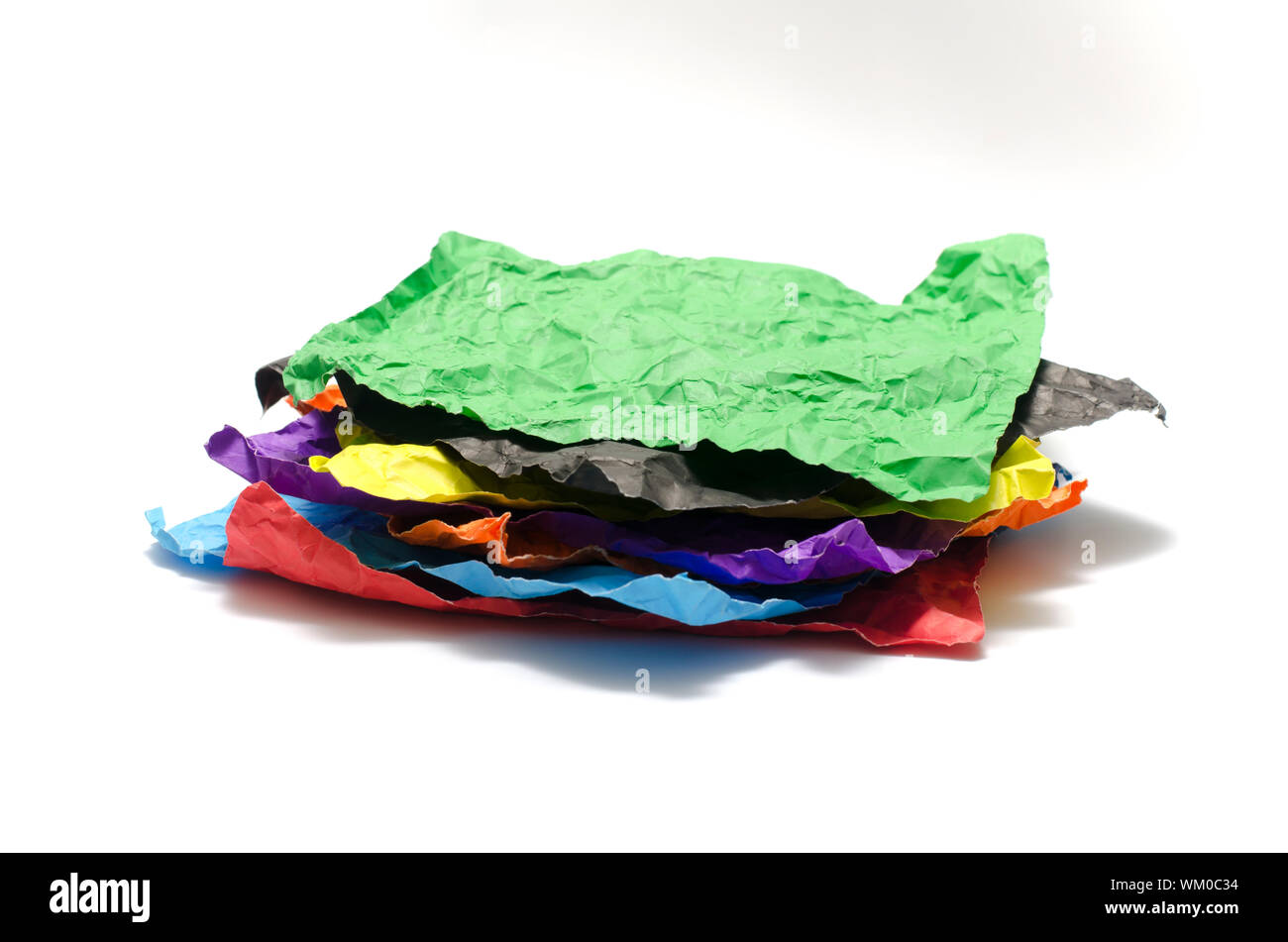 color crumpled paper on a white background Stock Photo - Alamy