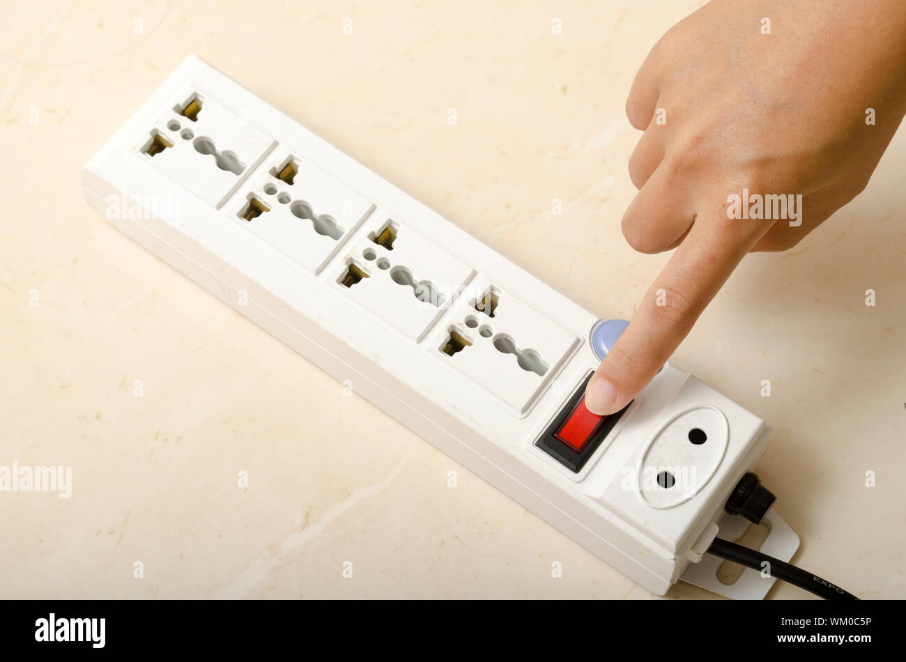 hand turn on switch multiple socket plug Stock Photo - Alamy