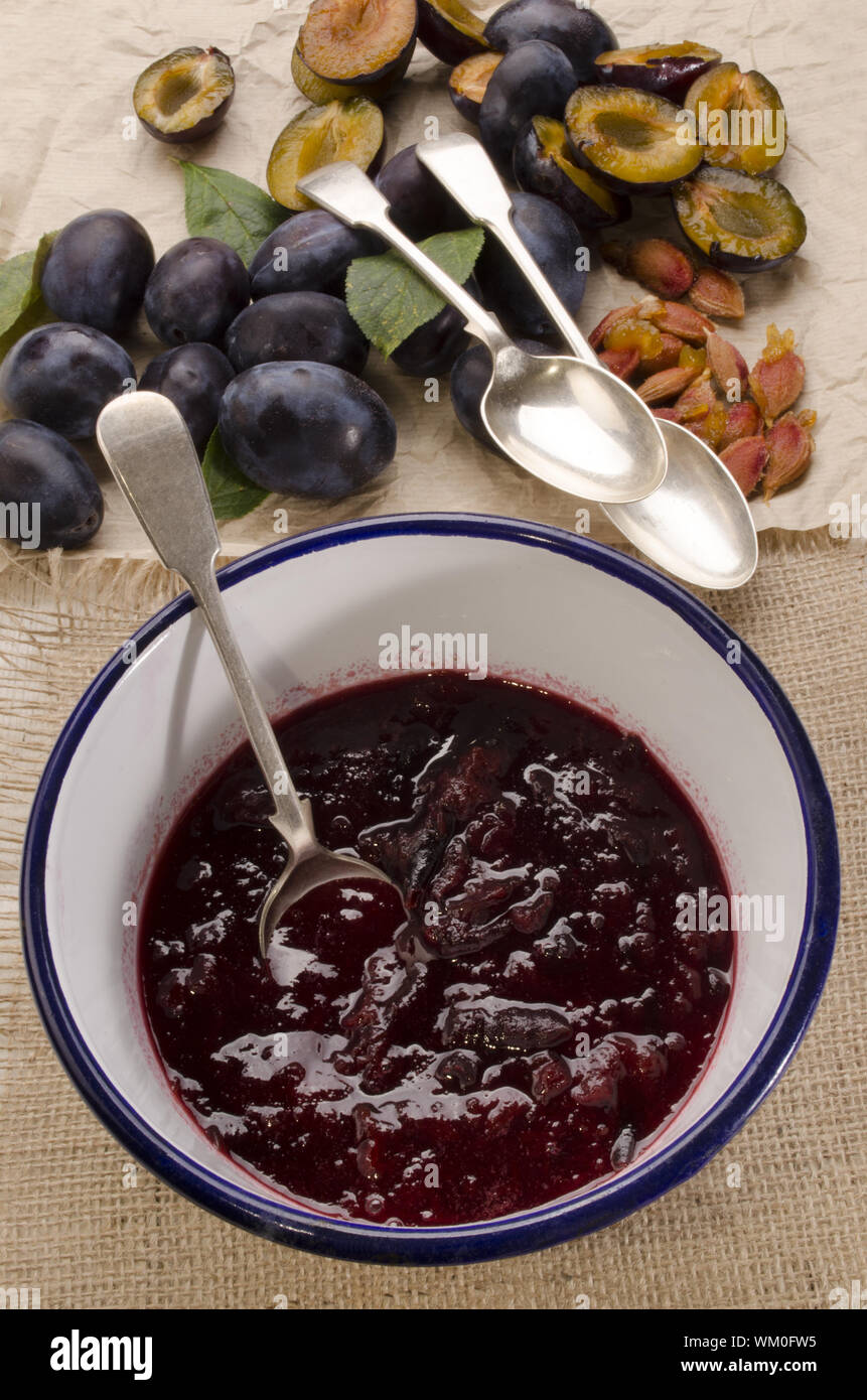 fresh plum jam with spoon in an enamel bowl Stock Photo - Alamy