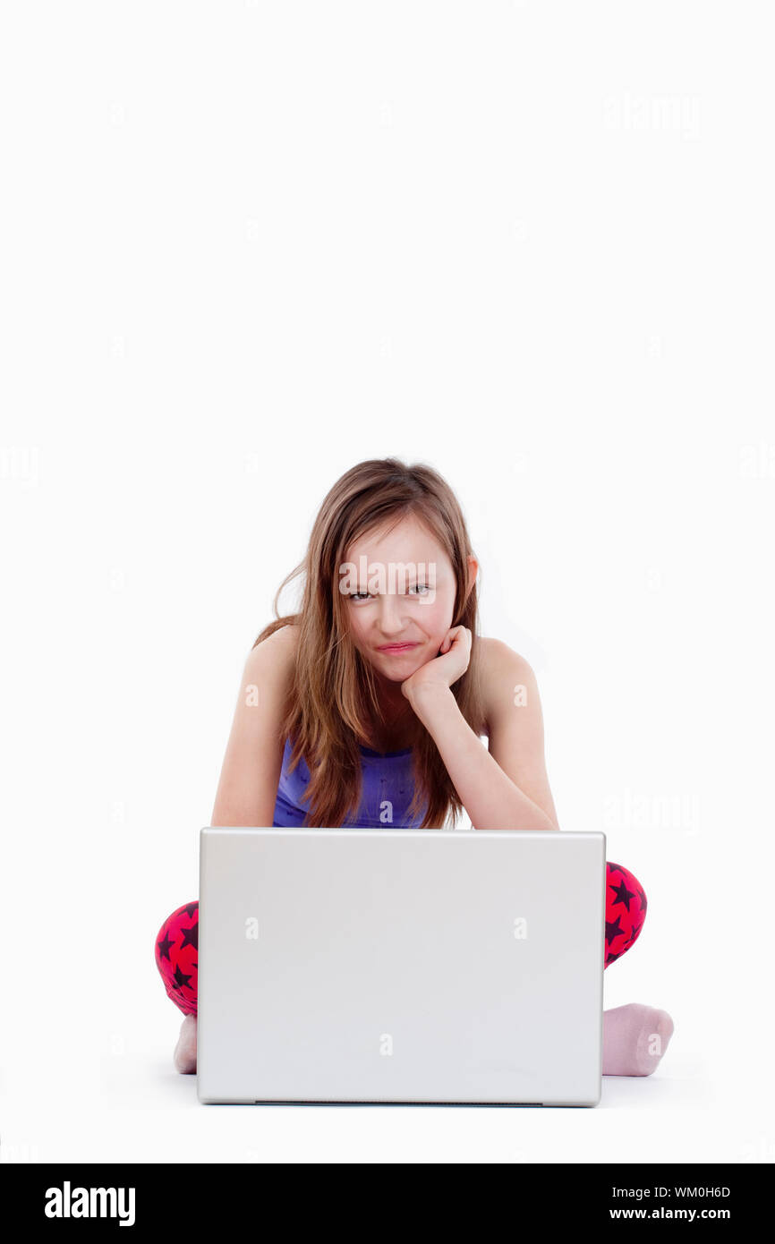 young girl with laptop computer smiling - isolated on white Stock Photo ...