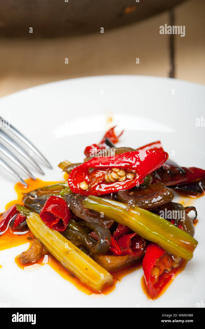 fried chili pepper and vegetable on a iron wok pan Stock Photo - Alamy
