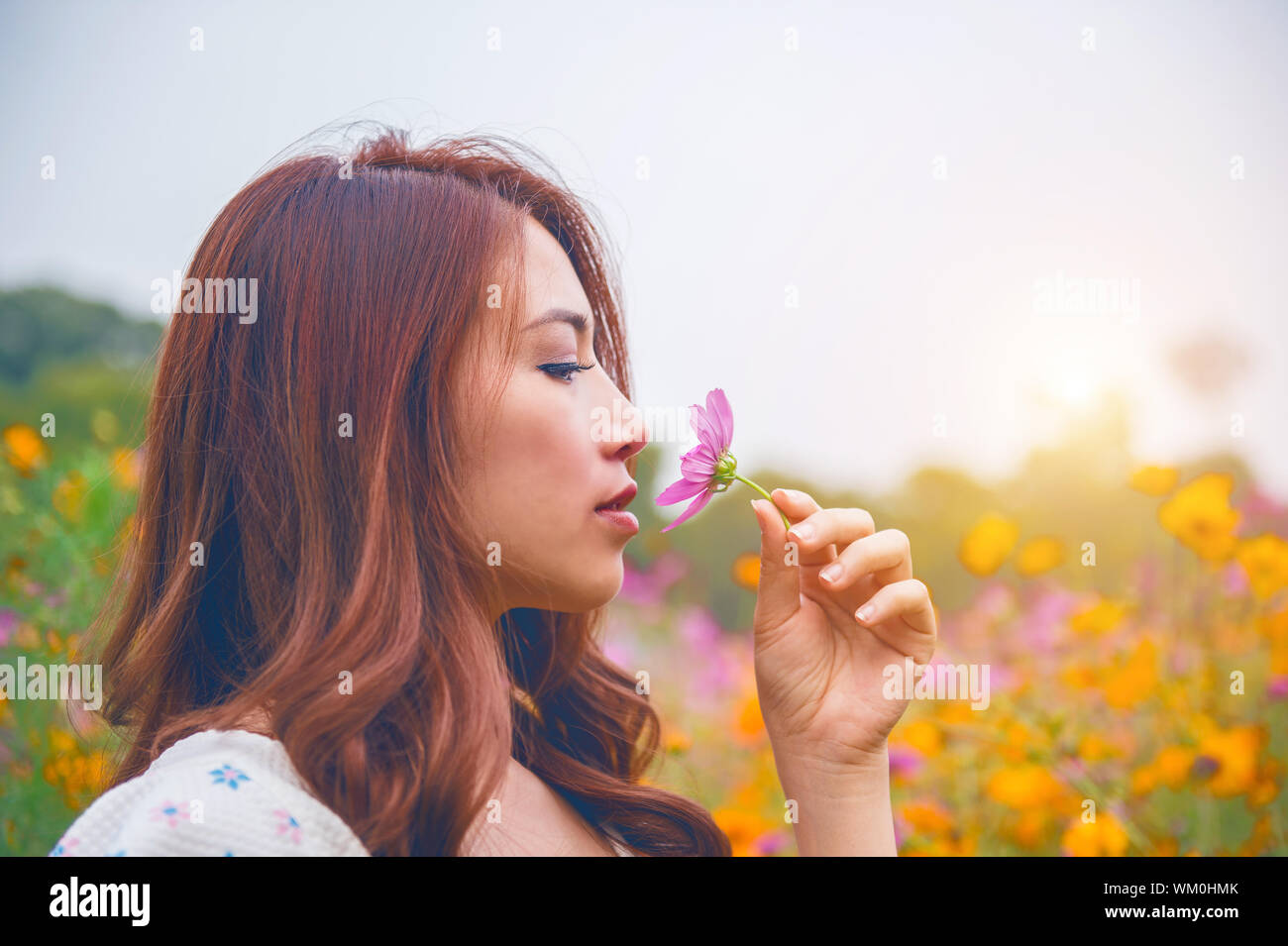 Smelling the flower hi-res stock photography and images - Alamy