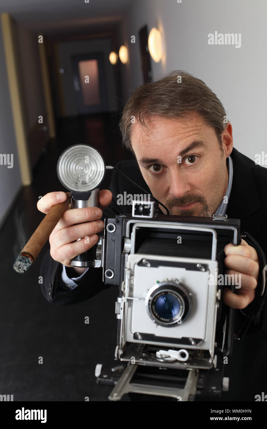 Photo of a retro 1940's style photographer taking a photo with an old ...