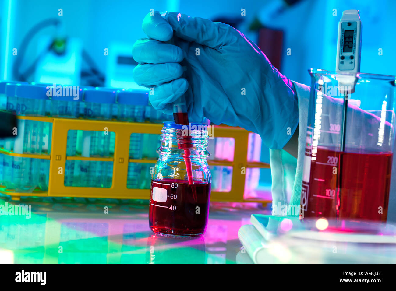researchers work in modern scientific lab. Preparation of hazardous ...
