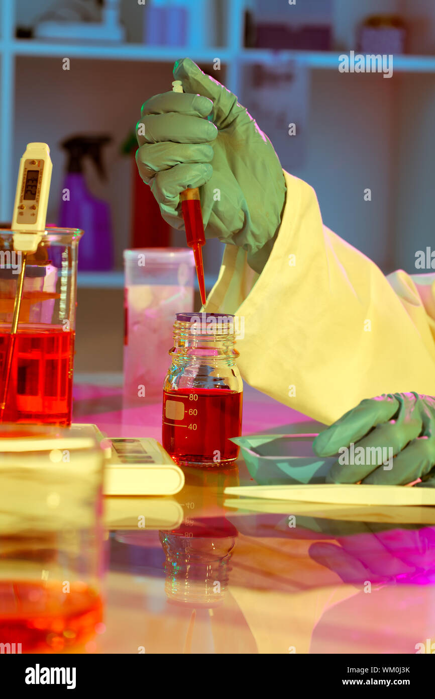 researchers work in modern scientific lab. Preparation of hazardous ...