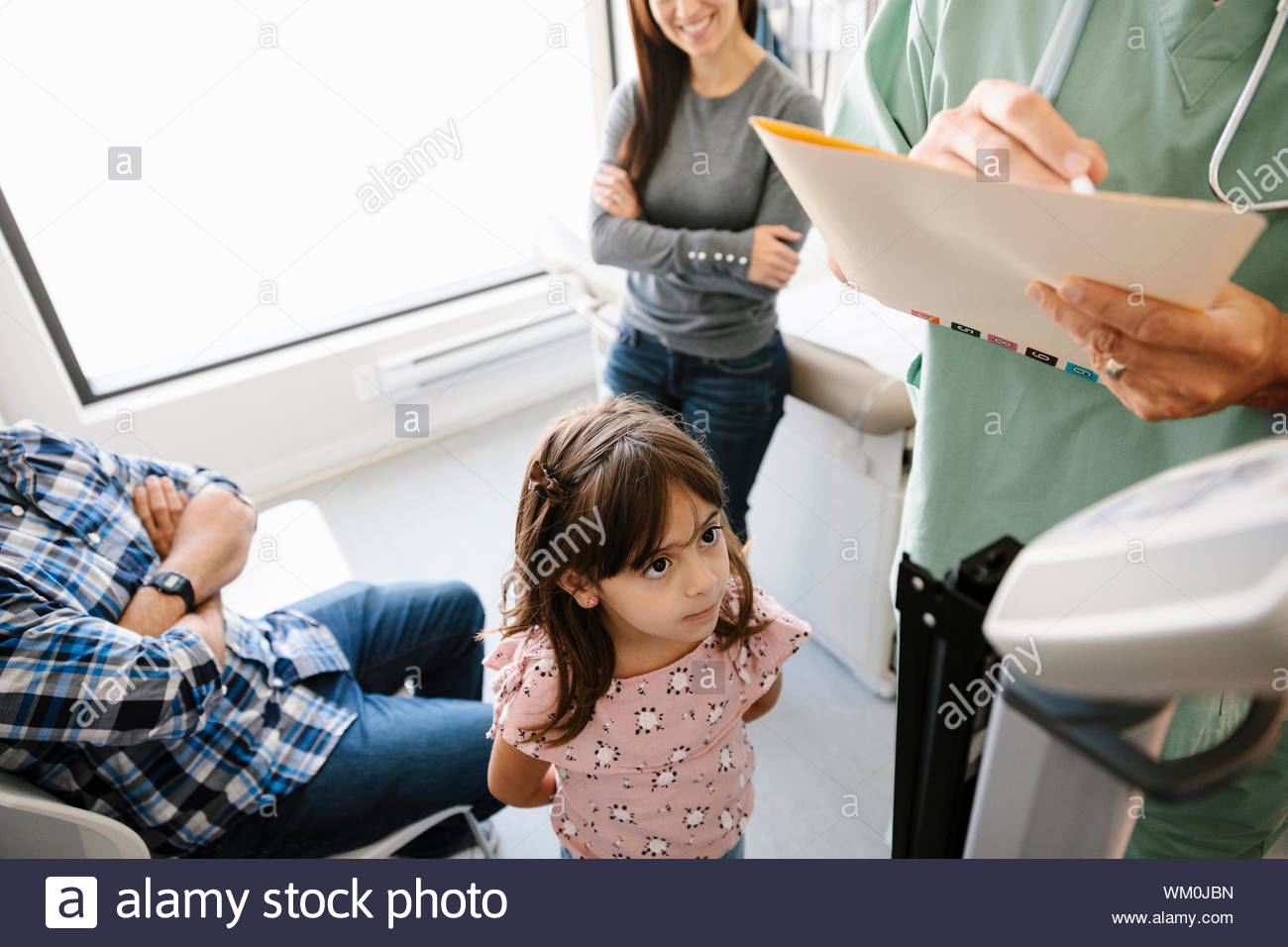 Patient standing on a weighing scale hi-res stock photography and ...