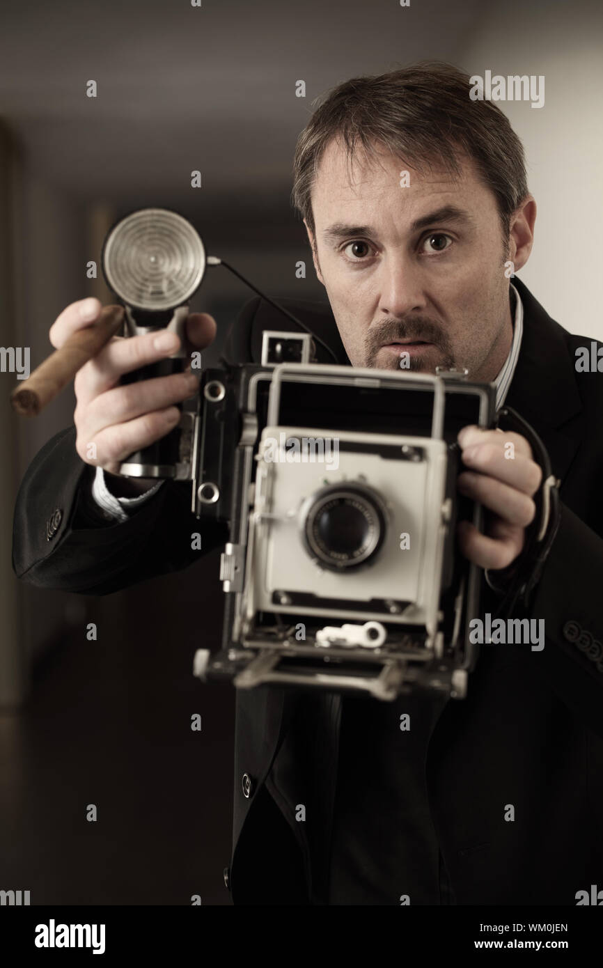 Photo of a retro 1940's style photographer taking a photo with an old ...
