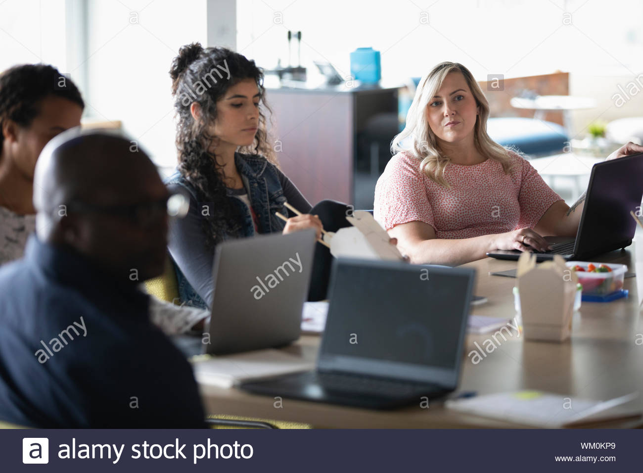 Two women eating in office hi-res stock photography and images - Alamy