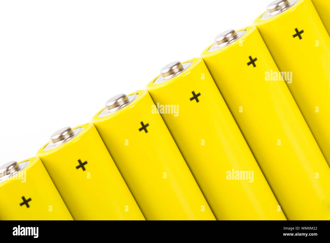yellow alkaline batteries closeup on white backgroun Stock Photo - Alamy