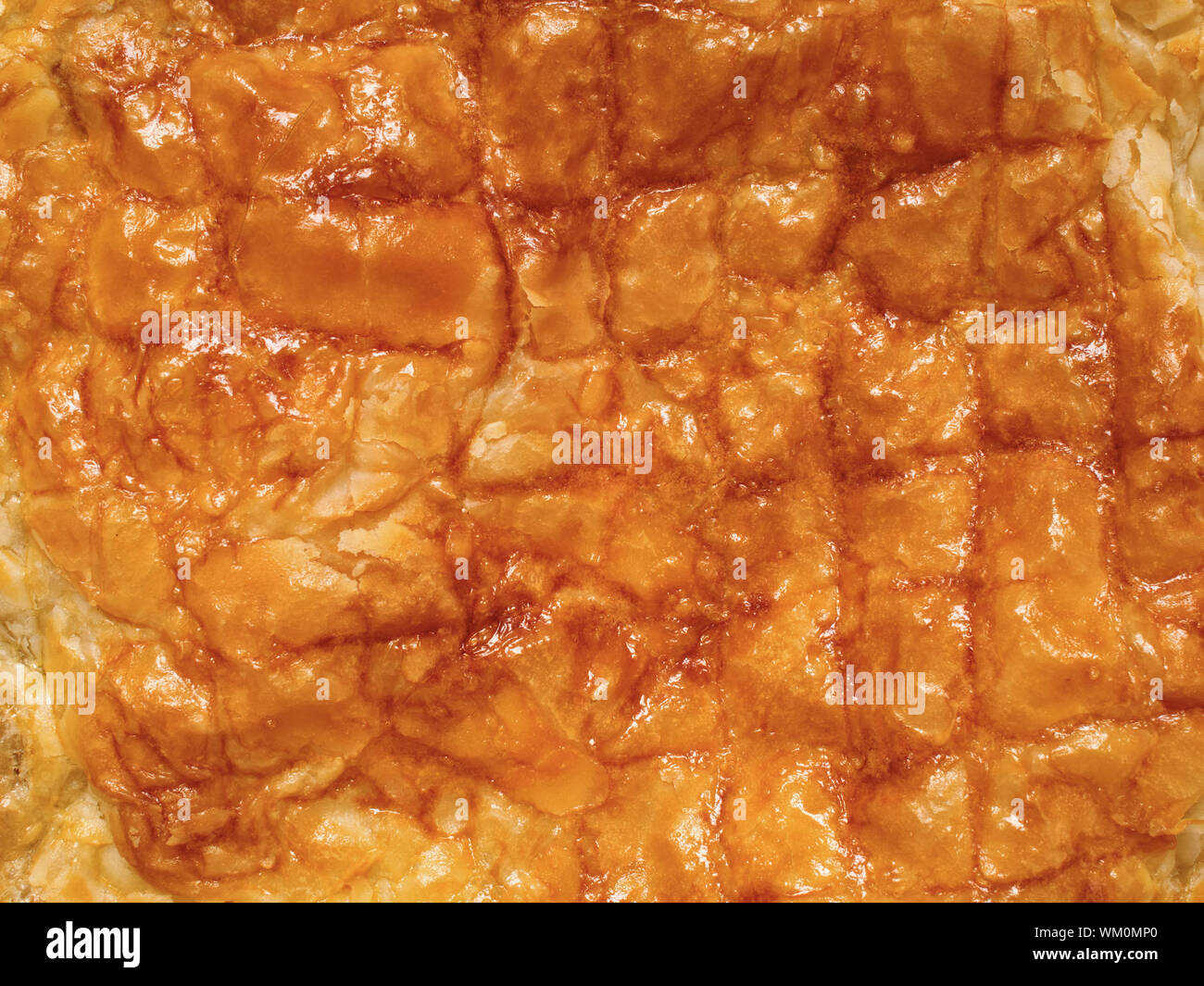 close up of flaky golden puff pastry pie crust food background Stock ...