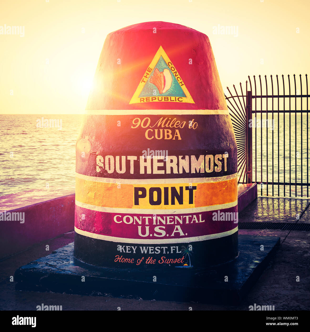 Florida Buoy sign marking the southernmost point at sunset Stock Photo ...