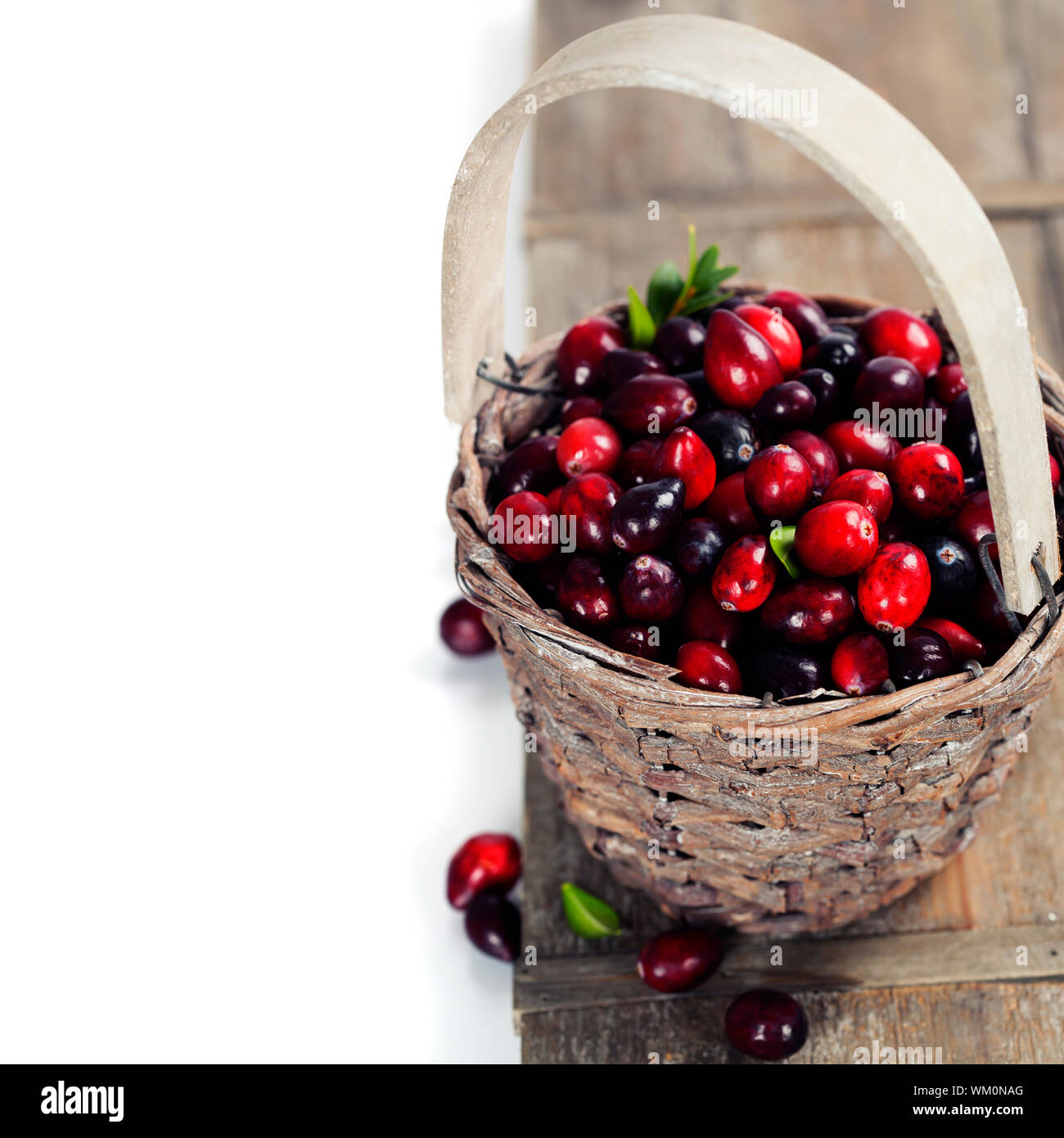 Basket cranberries on wooden hi-res stock photography and images - Alamy