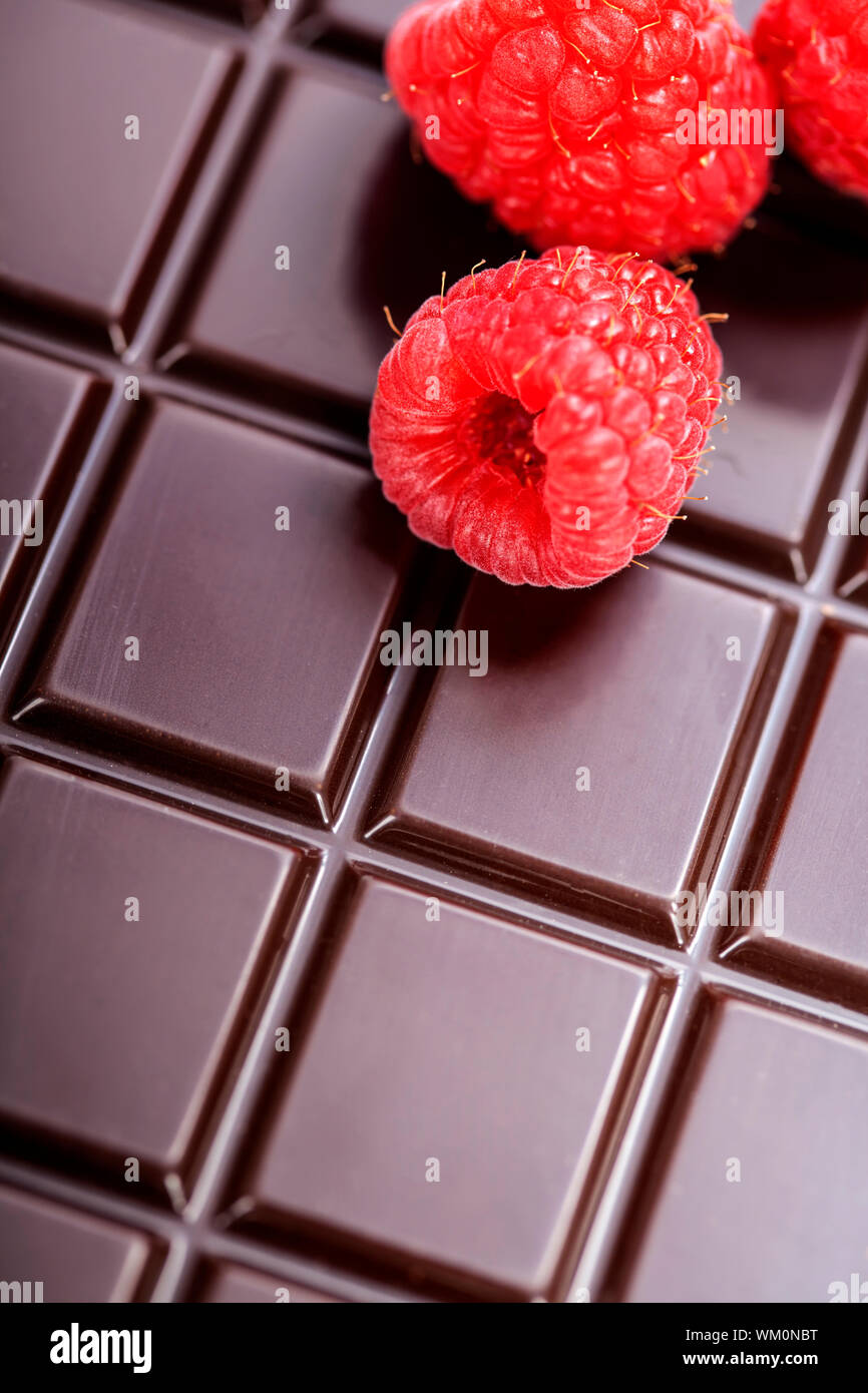dark chocolate bar with raspberry Stock Photo - Alamy
