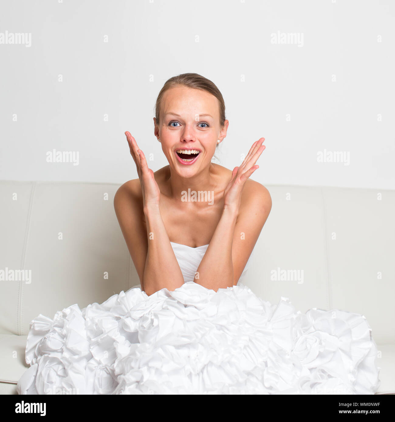 Wedding day moments series - Super excited, gorgeous, bride sitting on ...