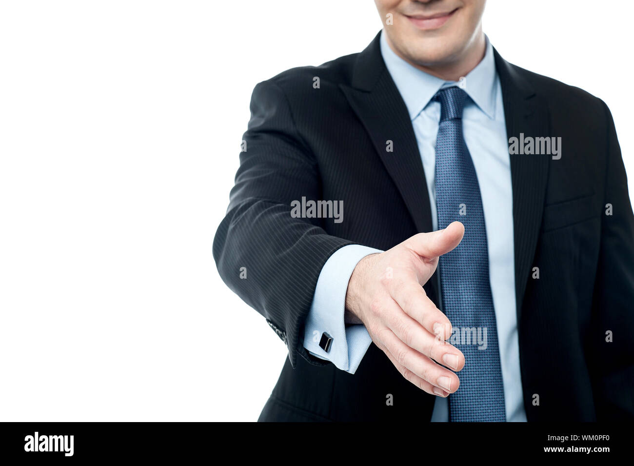 Cropped view of a business man offering a handshake Stock Photo - Alamy