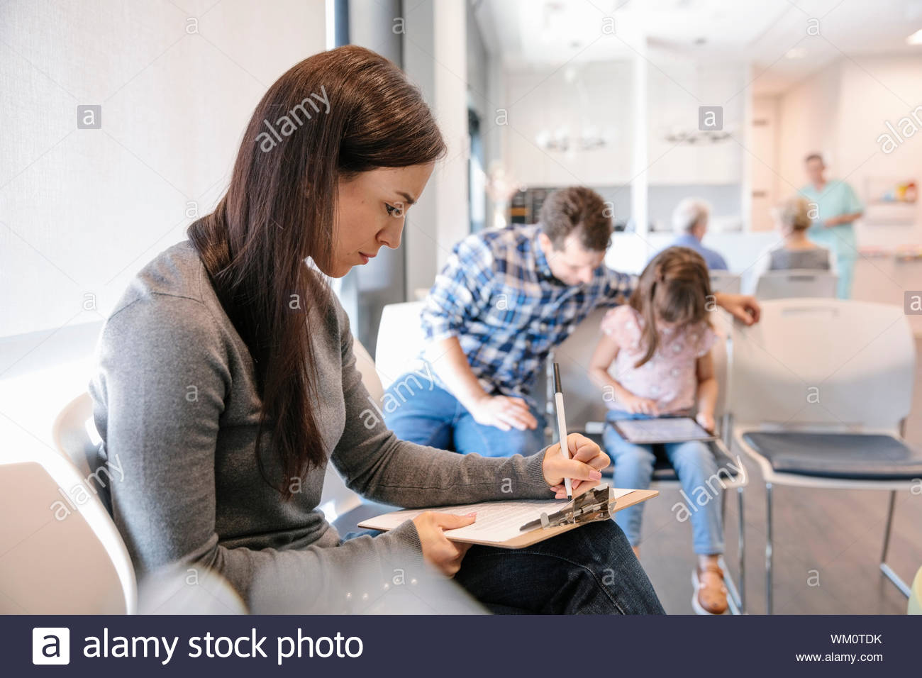 Woman waiting room hi-res stock photography and images - Alamy