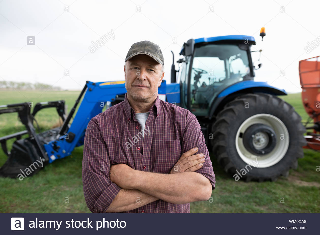 Farmer posing with tractor hi-res stock photography and images - Alamy