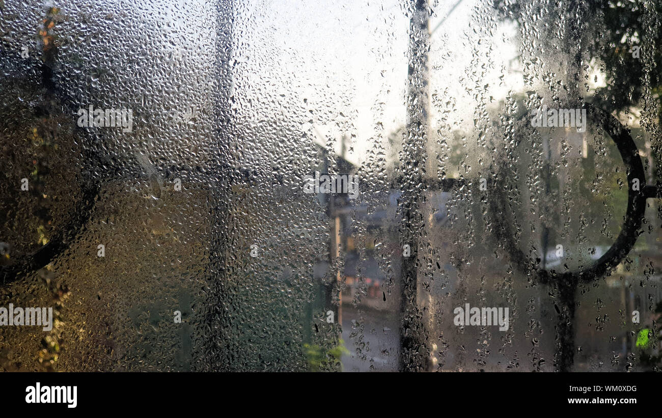 rain drops on glass window. a view from inside Stock Photo - Alamy