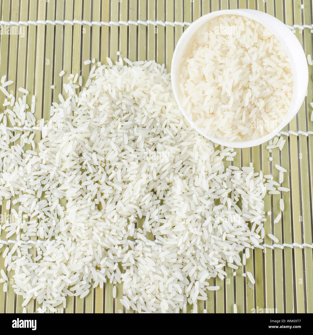 uncooked rice in mini bowl Stock Photo - Alamy