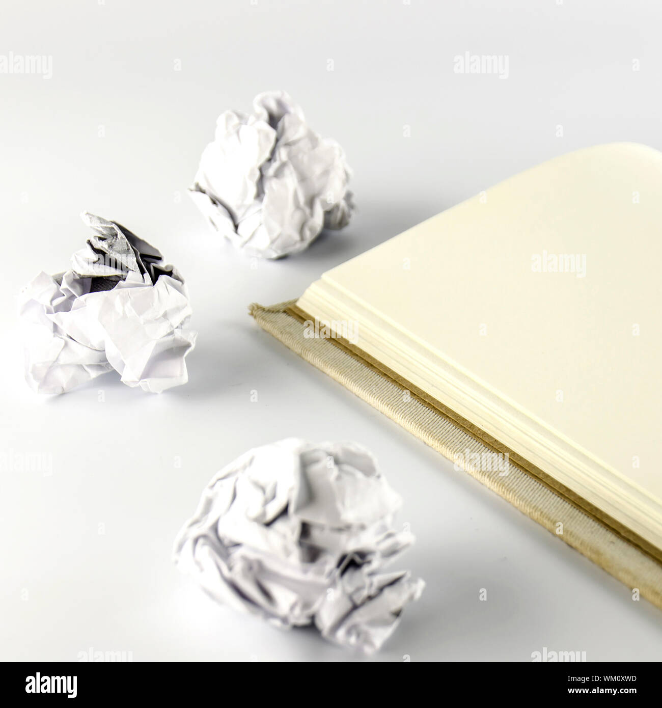 crumpled paper and notebook on a white background Stock Photo - Alamy