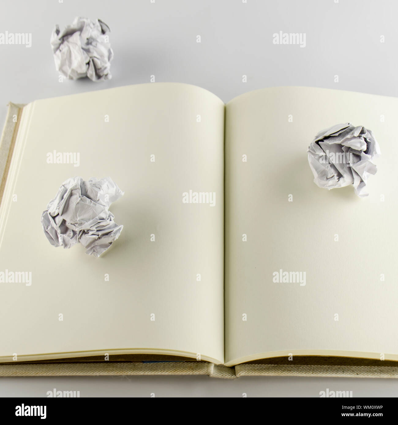 crumpled paper and notebook on a white background Stock Photo - Alamy