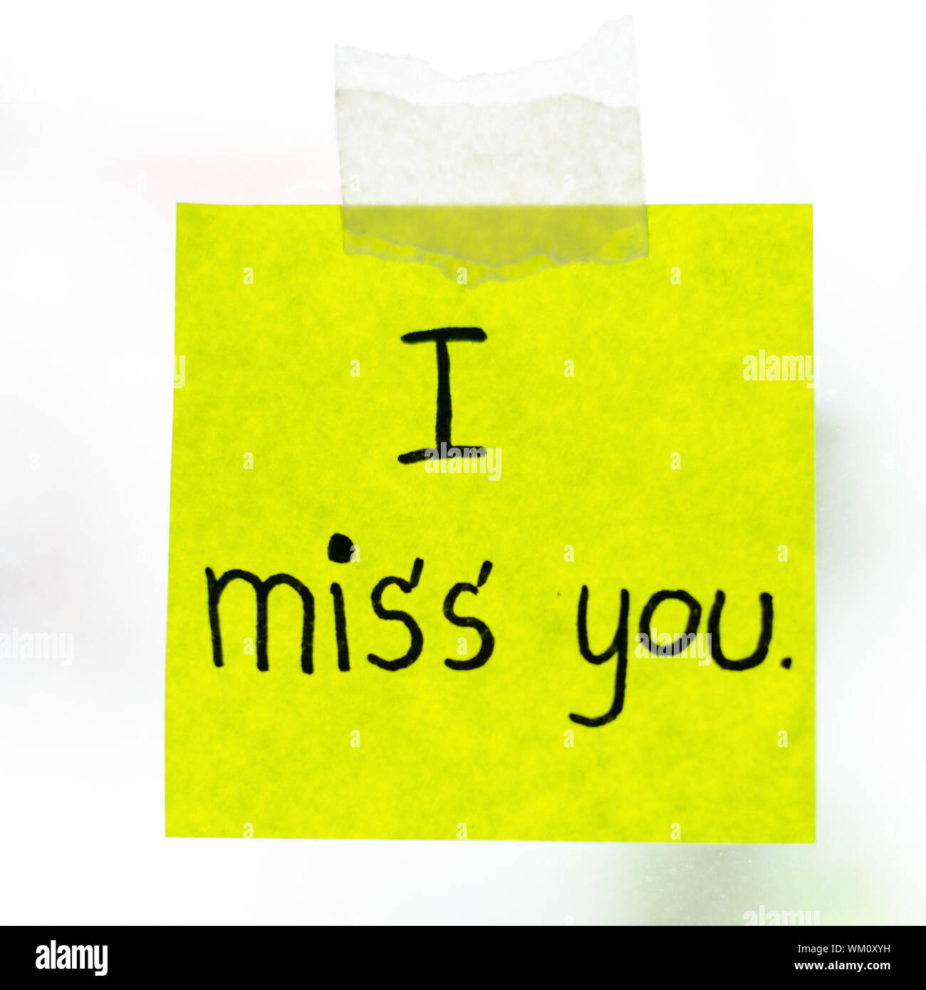 I miss you word sticky note on window mirror Stock Photo - Alamy