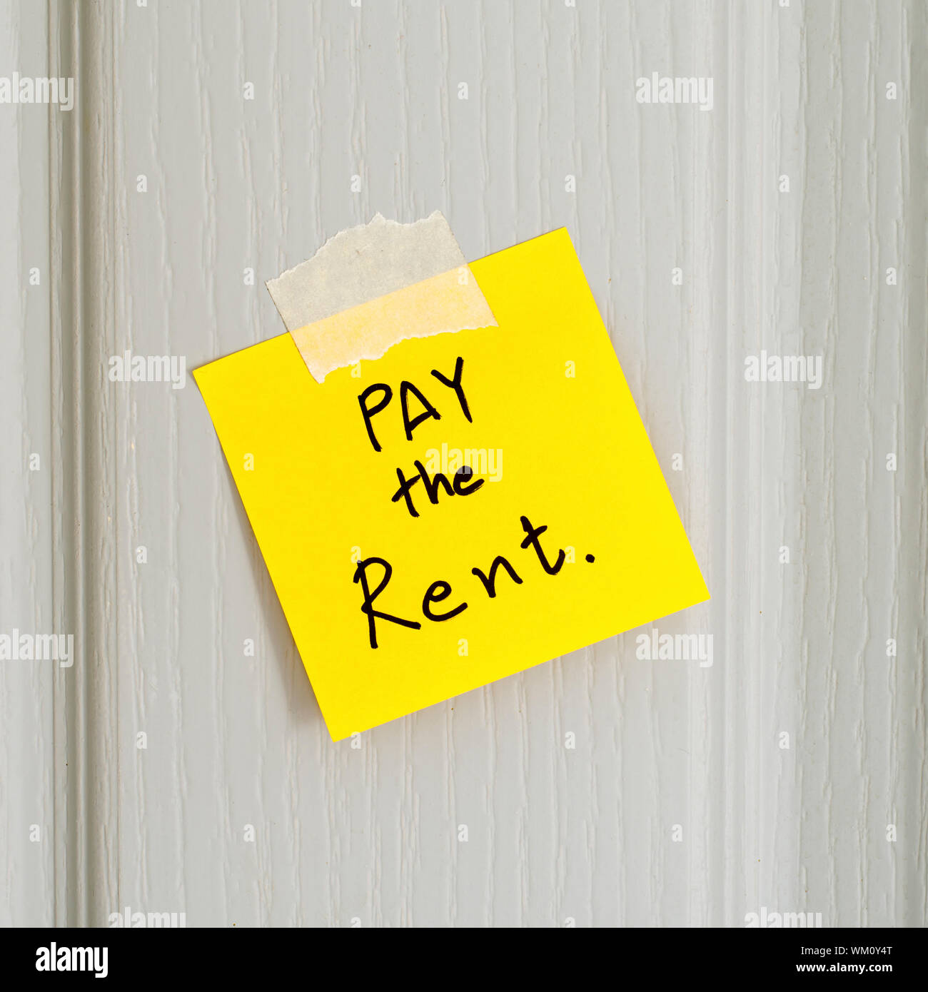 sticky note write a message pay the rent Stock Photo - Alamy