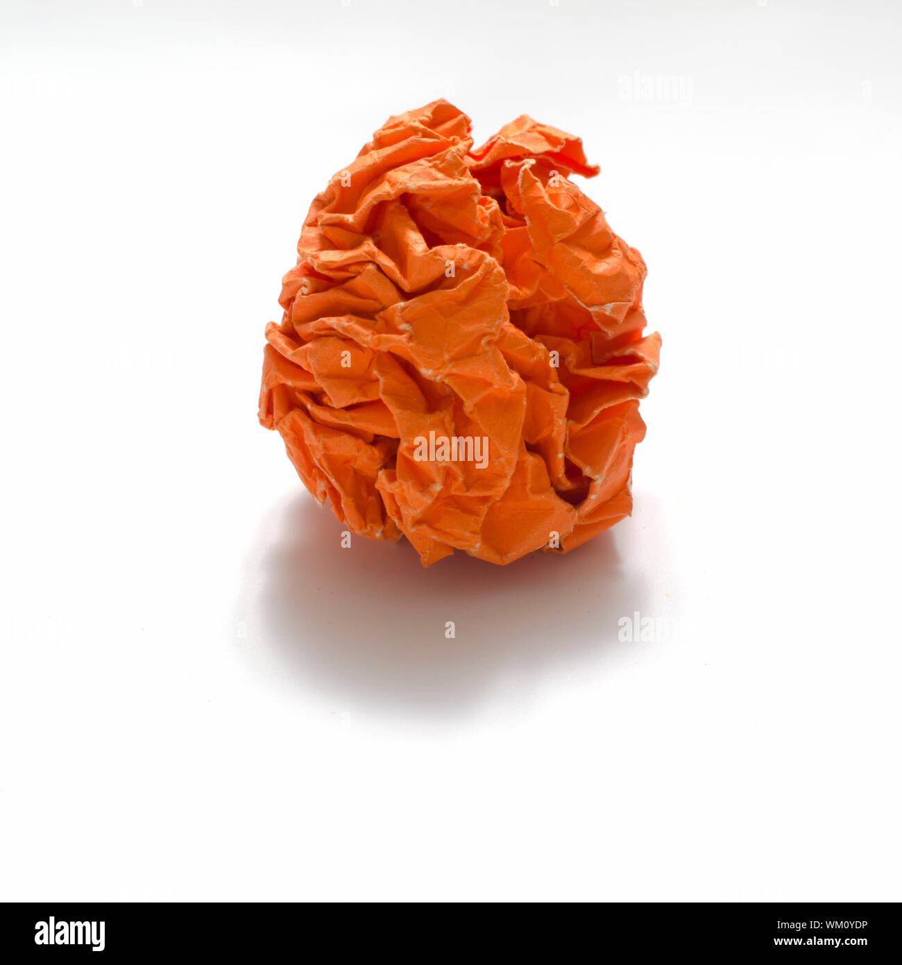 color crumpled paper ball on a white Stock Photo - Alamy