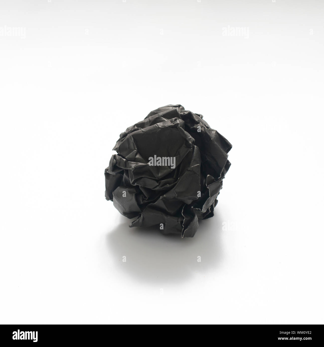 color crumpled paper ball on a white Stock Photo - Alamy