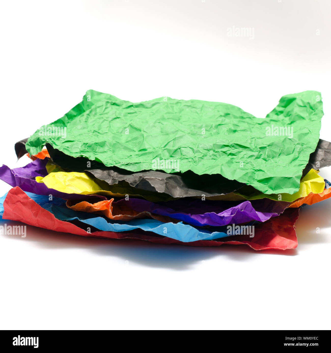 color crumpled paper on a white background Stock Photo - Alamy