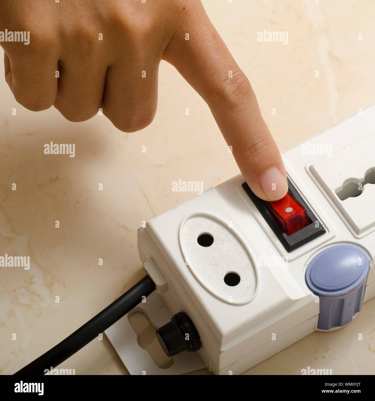 hand turn on switch multiple socket plug Stock Photo - Alamy