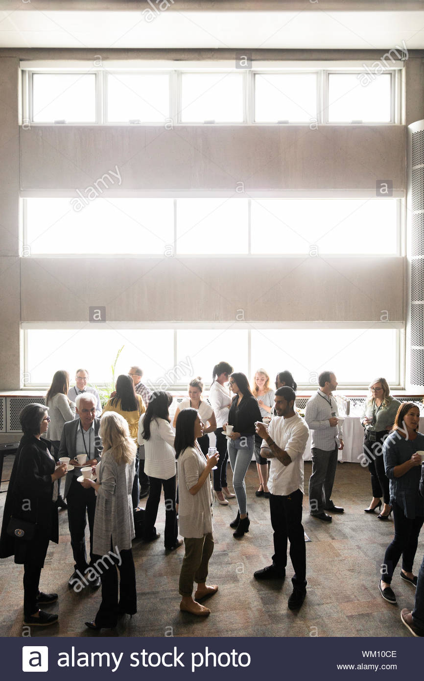 Group of people talking at conference hi-res stock photography and ...