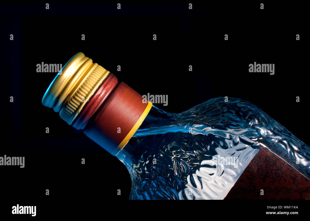 The bottle in the color light Stock Photo - Alamy