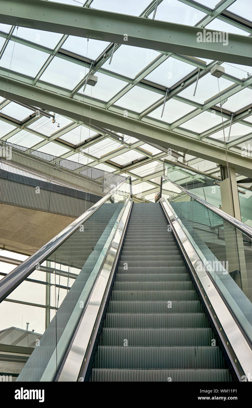 Escalator under a large glass roof Stock Photo - Alamy