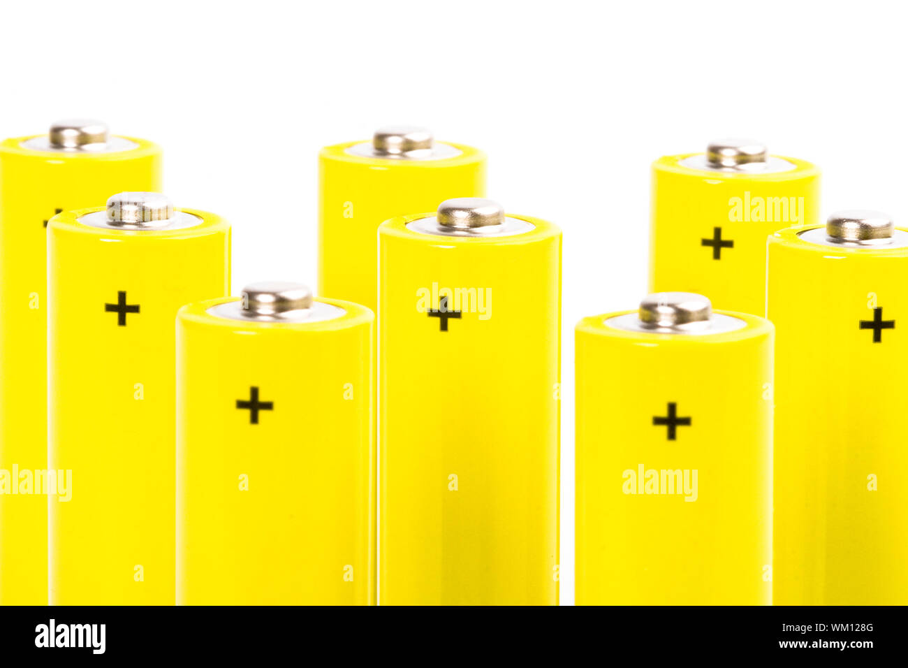 eight yellow alkaline batteries closeup on white backgroun Stock Photo ...