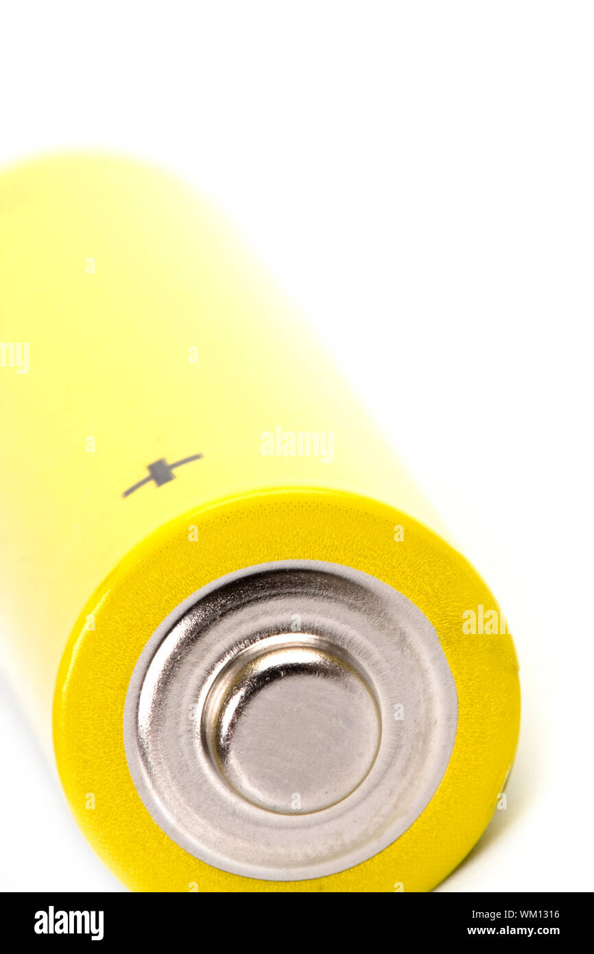 yellow alkaline battery closeup on white background Stock Photo - Alamy