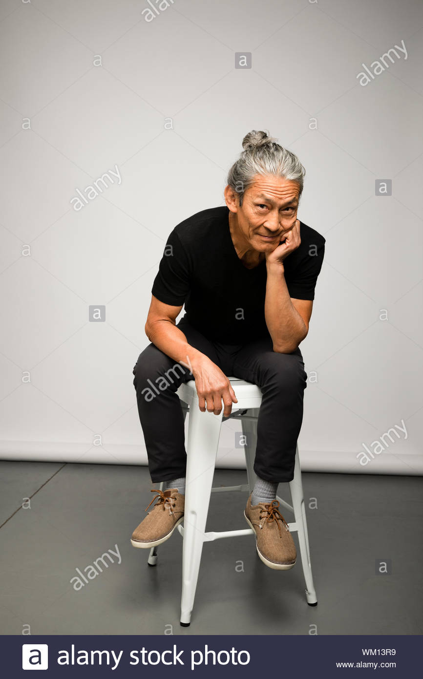 Baby sitting on stool hi-res stock photography and images - Alamy