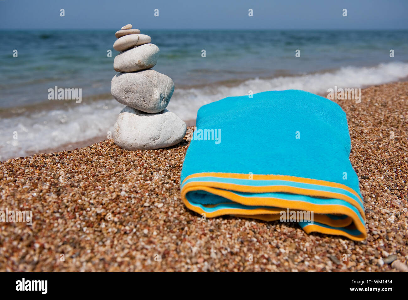 Spa with a pile of pebbles at the beach Stock Photo - Alamy