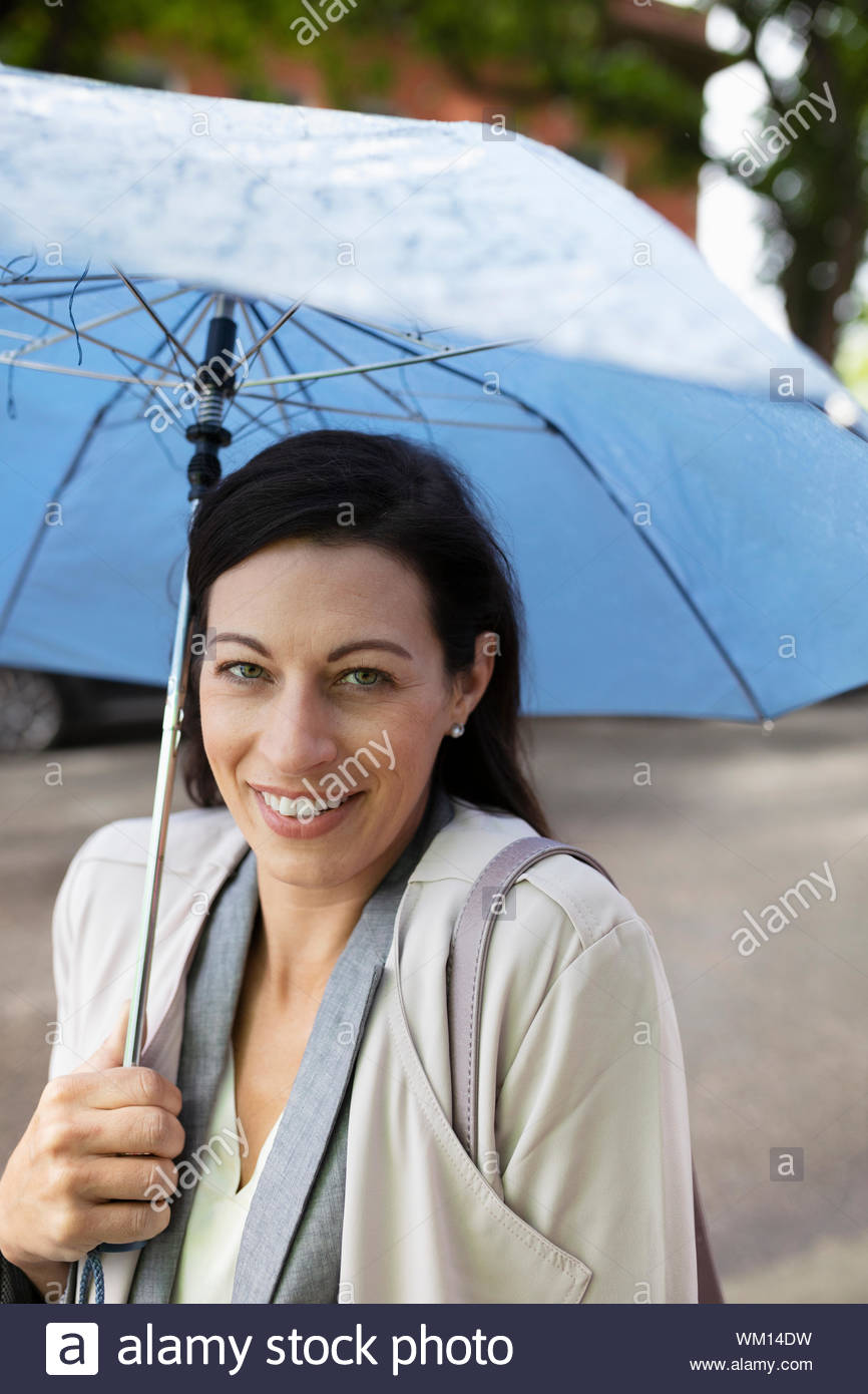 Woman umbrella smiling hi-res stock photography and images - Alamy