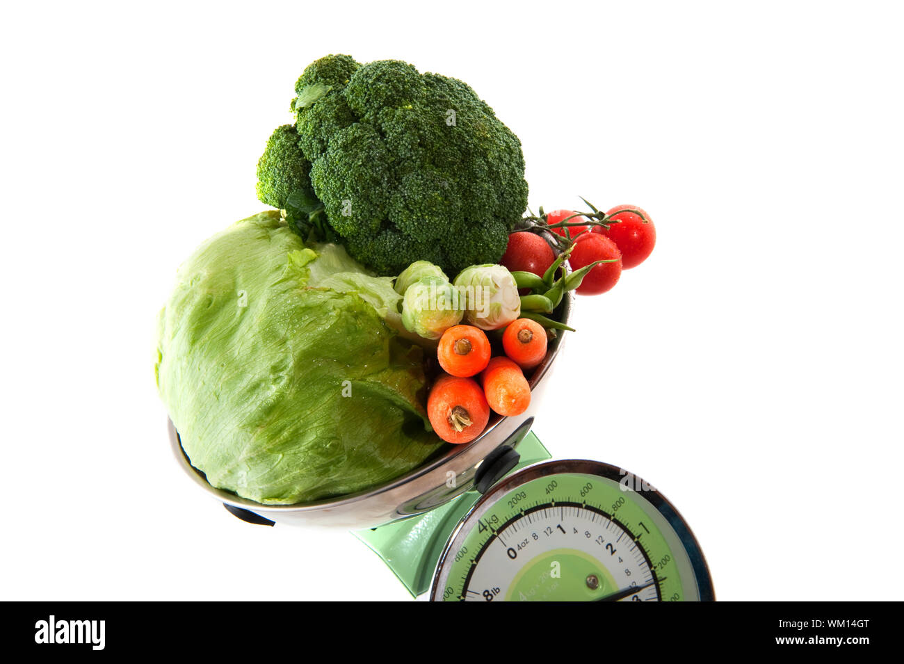 Healthy weight with fresh vegetables at a scale Stock Photo - Alamy