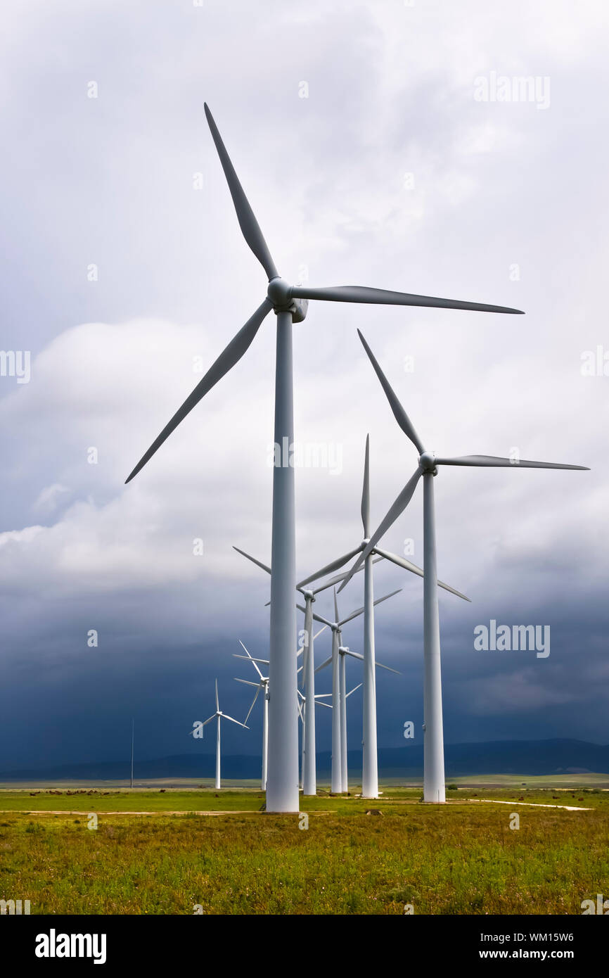 Wind turbines generating electricity in a stormy weather Stock Photo ...