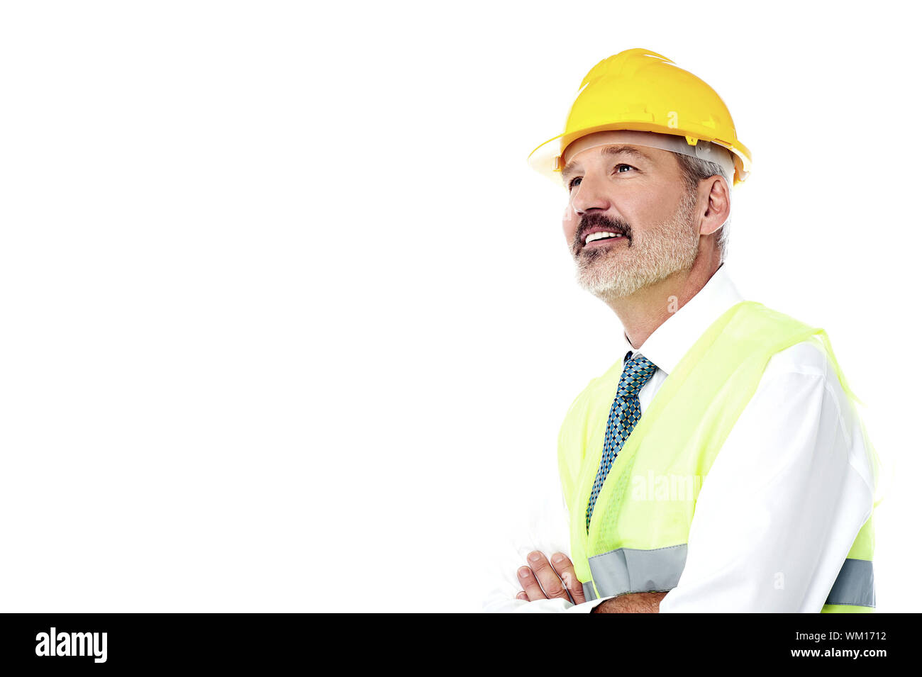 Construction engineer posing with crossed arms Stock Photo - Alamy
