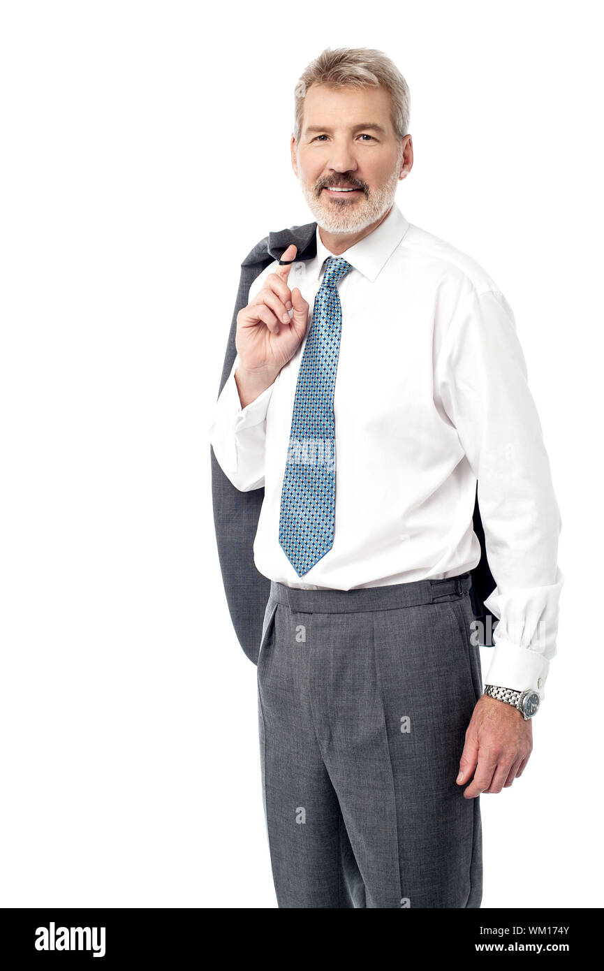Businessman with coat slung over shoulder Stock Photo - Alamy