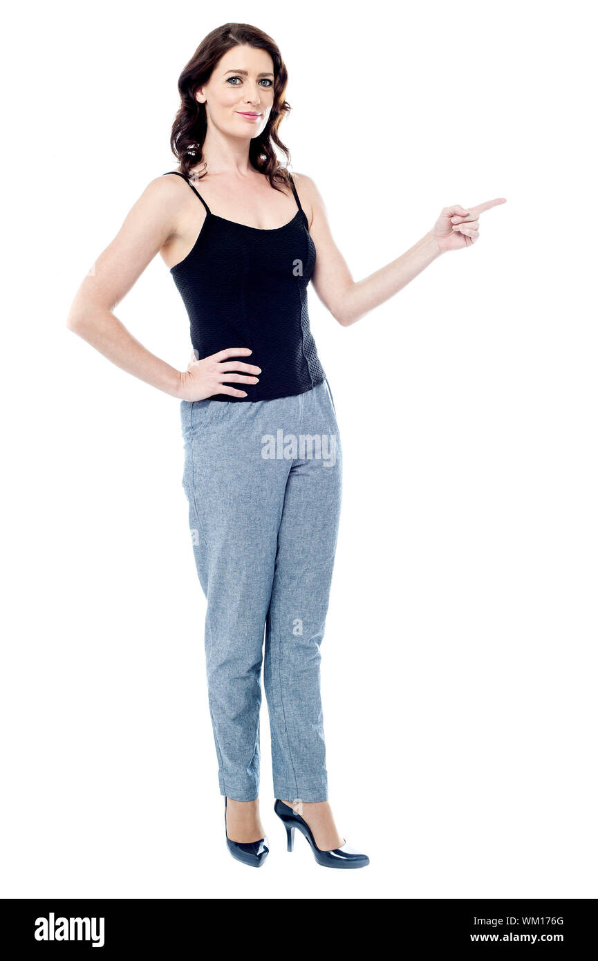 Beautiful casual woman pointing, isolated on white Stock Photo - Alamy