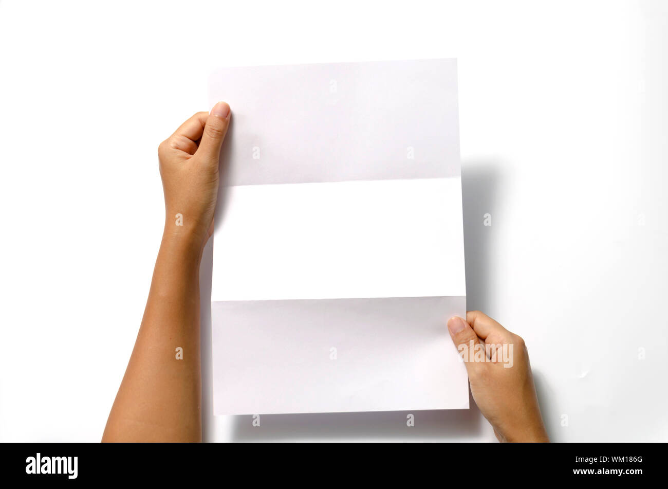 woman two hands holding paper Stock Photo - Alamy