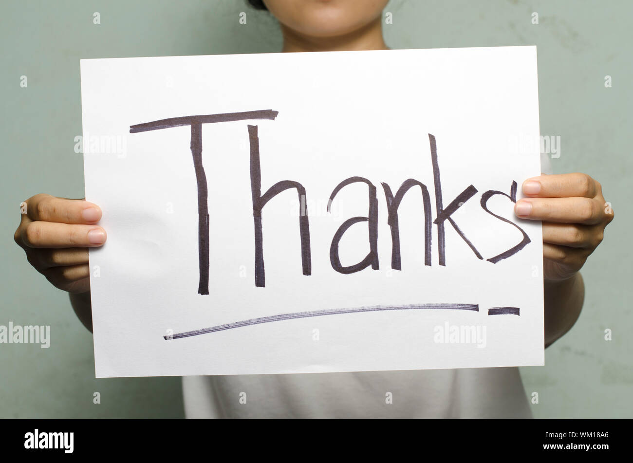 hand holding paper write thanks word Stock Photo - Alamy